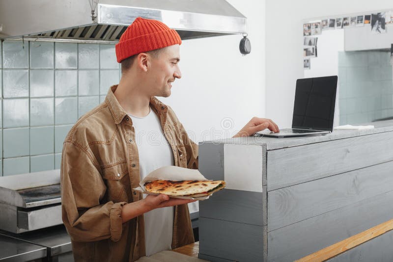 Chef Accepts Order from Internet in a Cafe Stock Image - Image of note ...