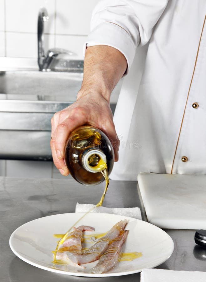 Chef add oil stock image. Image of preparation, commercial - 11720025