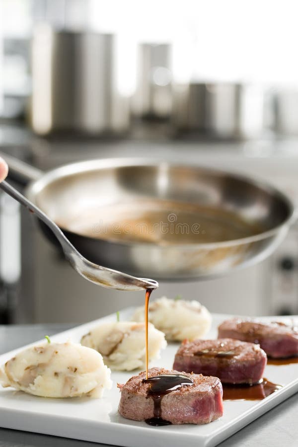 Chef Add Sause To a Beef Steaks, Light One Stock Image - Image of hand ...