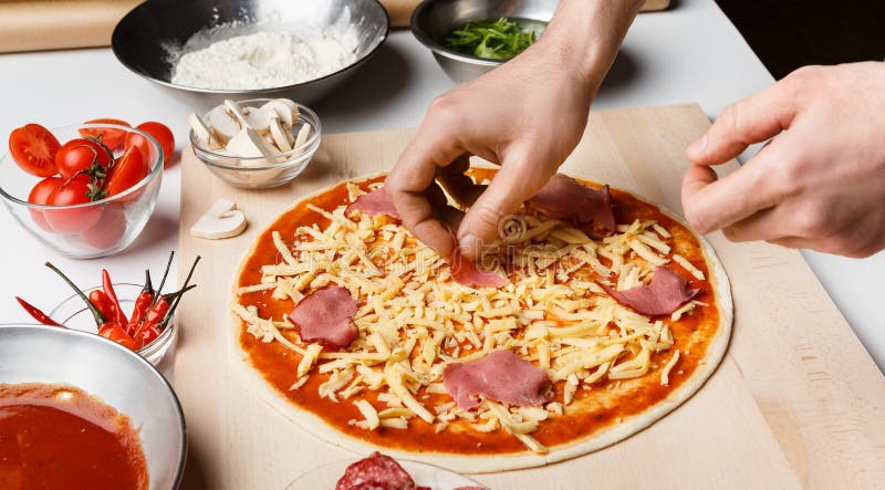 Chef Adding Ham Slices on Pizza in Restaurant Stock Photo - Image of ...