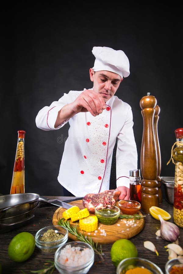 Chef Adding Salt and Pepper To Dorada Fish. Stock Photo - Image of fish ...