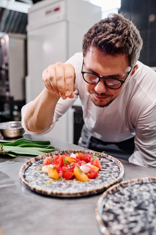 Chef Adding Spices in Salad Stock Photo - Image of chef, concentration ...
