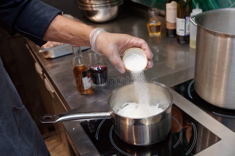 Chef Adding Seasoning To Dish in Restaurant Stock Photo - Image of ...