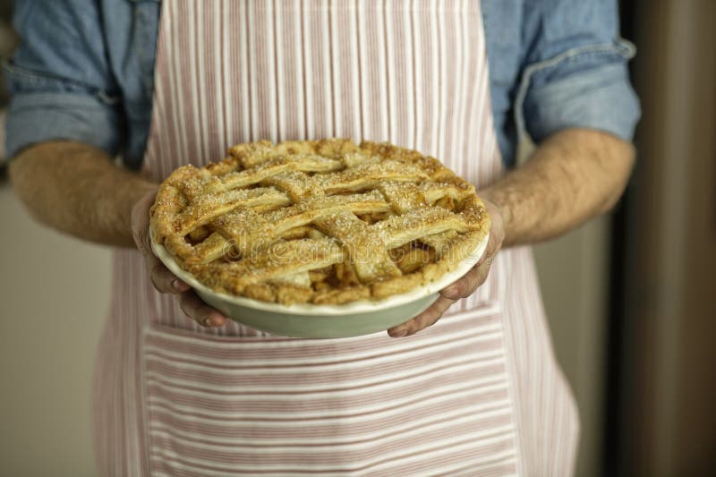 Chef in an Apron Holding a Plate with Delicious Apple Pie Stock Photo ...