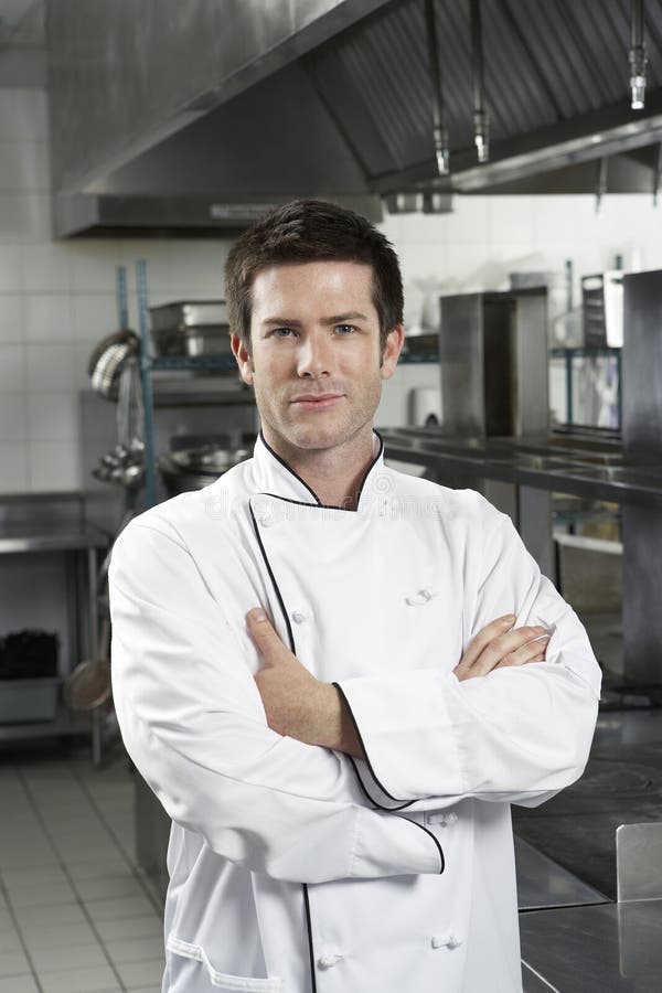 Chef with Arms Crossed in Kitchen Stock Photo - Image of kitchen ...
