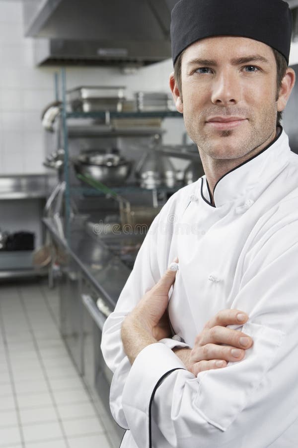 Chef with Arms Crossed in Kitchen Stock Image - Image of arms, chefs ...