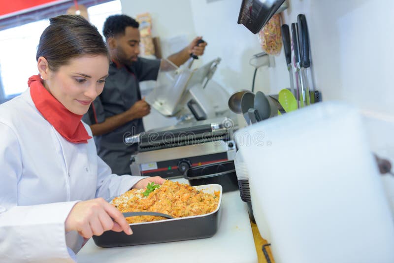Assistant and Chef Discussing Menu in Kitchen Stock Image - Image of ...