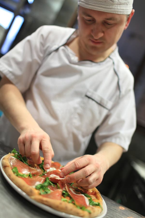 Chef Making Pizza at Kitchen Stock Photo - Image of chef, board: 35589184