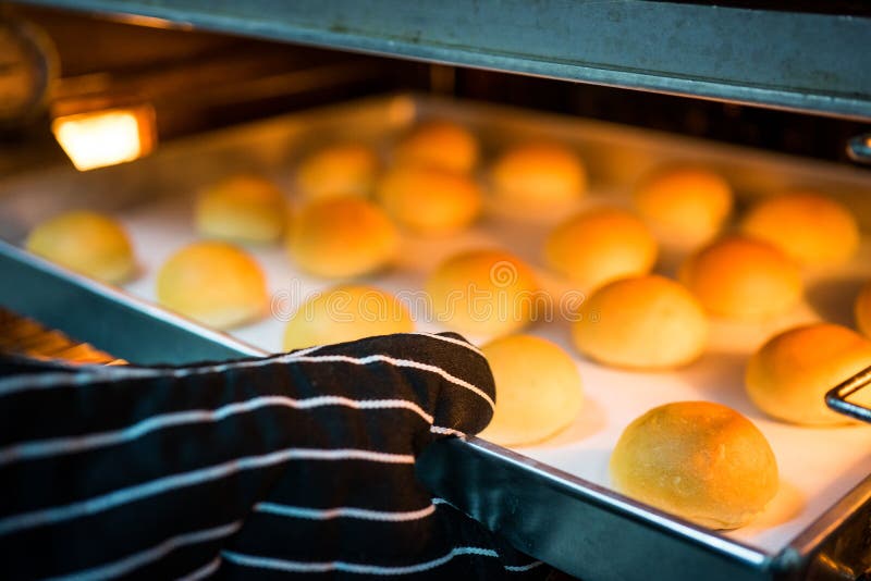 The chef is baking bread. stock image. Image of industry - 110771561