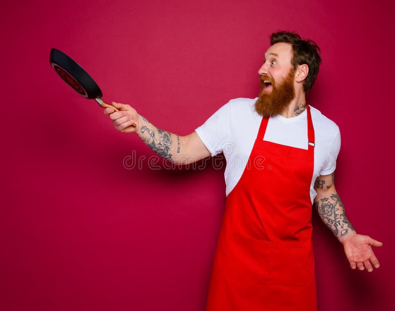 Happy Chef with Beard and Red Apron Cooks with Pan Stock Photo - Image ...