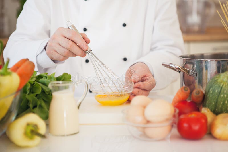Chef Beating Eggs stock photo. Image of close, cook, horizontal - 34875704