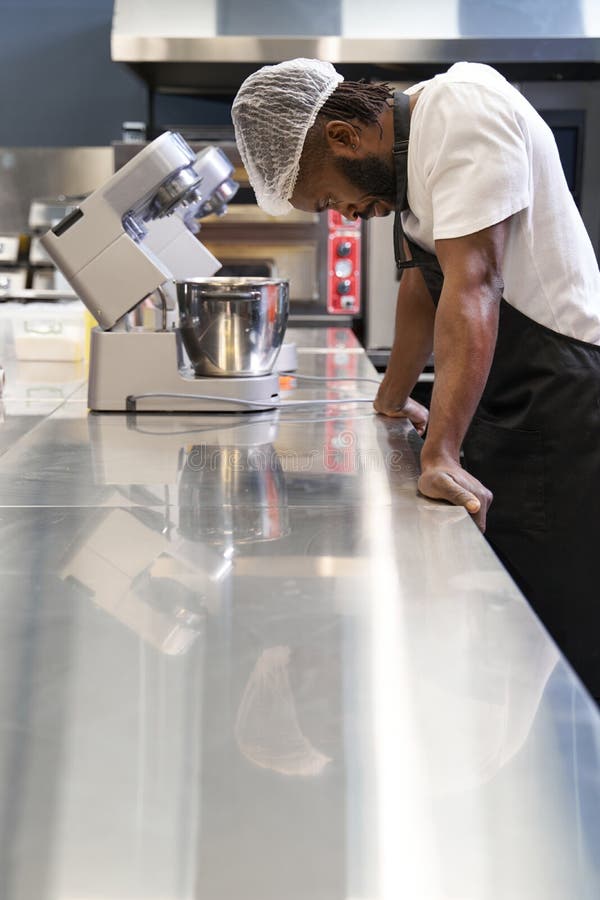 African Male Resting after Work in the Kitchen Stock Photo - Image of ...