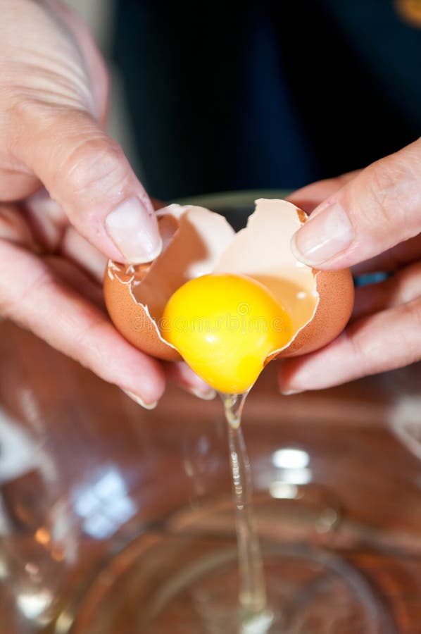 Chef breaking an egg stock image. Image of yellow, isolated - 16216331
