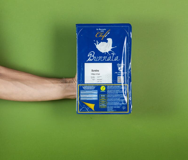Chef Burrata Cheese Packaging Held Against a Vibrant Green Background ...
