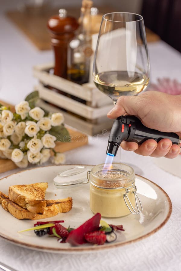 Chef Caramelizing Creme Brulee with a Torch Stock Image - Image of ...