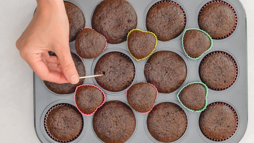 Chef Checking Cupcakes for Doneness by Using the Toothpick Test Stock ...