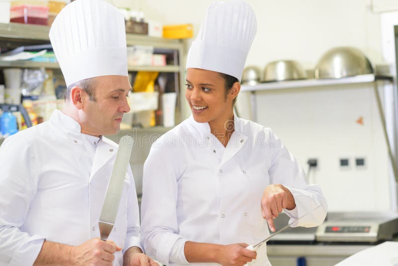 Chef checking at intern stock photo. Image of healthy - 196545594
