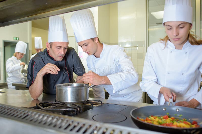 Chef Checking Assistants Cakes Stock Photo - Image of industry, eating ...