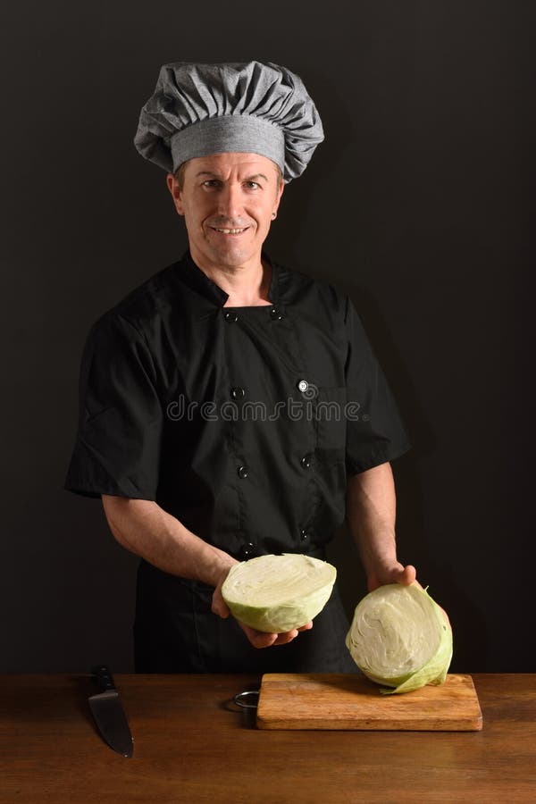 Chef chopping a cabbage stock photo. Image of attractive - 176077350