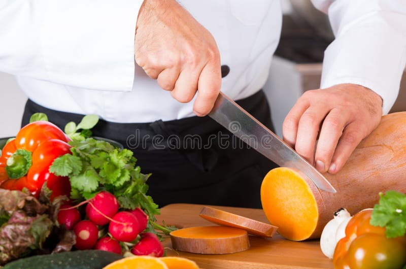 Chef chopping vegetables stock photo. Image of boss, male - 77565456