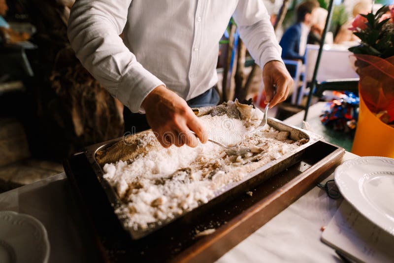 The Chef Chops the Fish Baked in Salt. Stock Photo - Image of cook ...