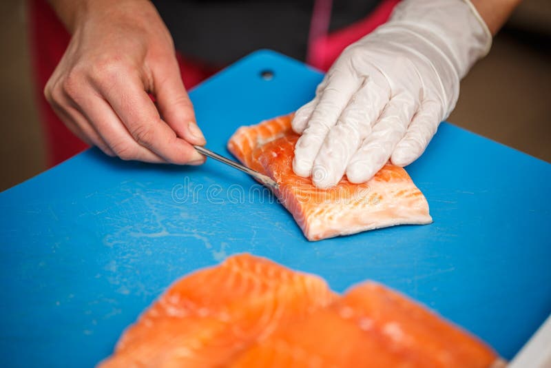 Chef cleaning salmon stock image. Image of fillet, bone - 88588953
