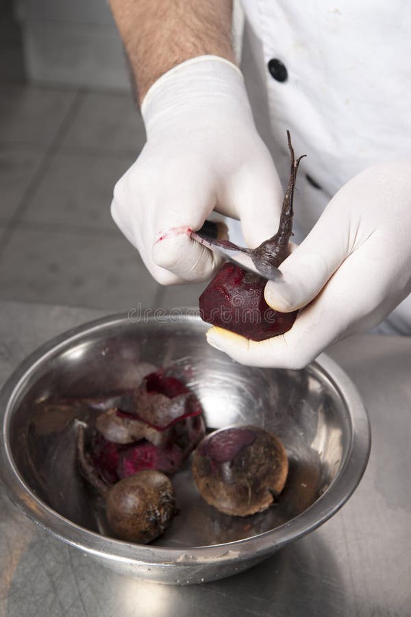 The Chef Cleans the Red Beetroot in the Kitchen Stock Photo - Image of ...