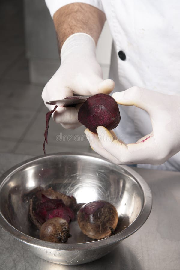 The Chef Cleans the Red Beetroot in the Kitchen Stock Photo - Image of ...