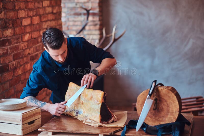 Chef Cook Cutting Exclusive Jerky Meat on Table in a Kitchen with Loft ...