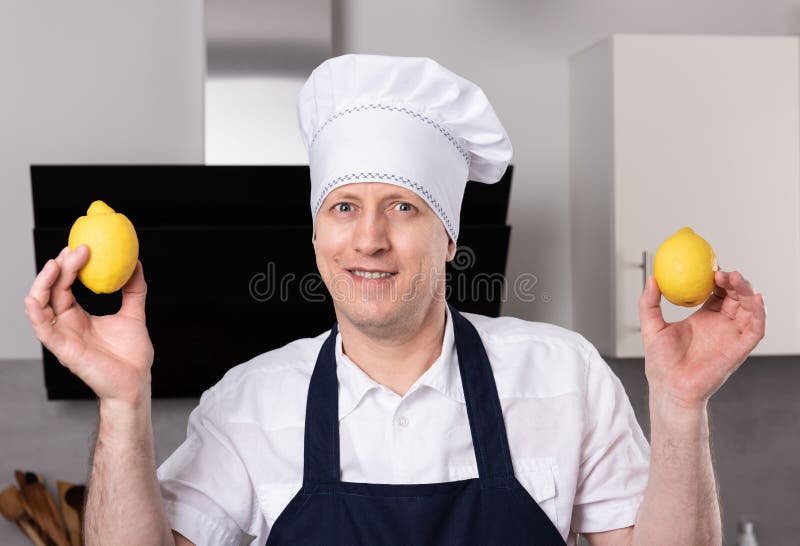Chef Cook in the Kitchen with Lemons in His Hands Stock Photo - Image ...