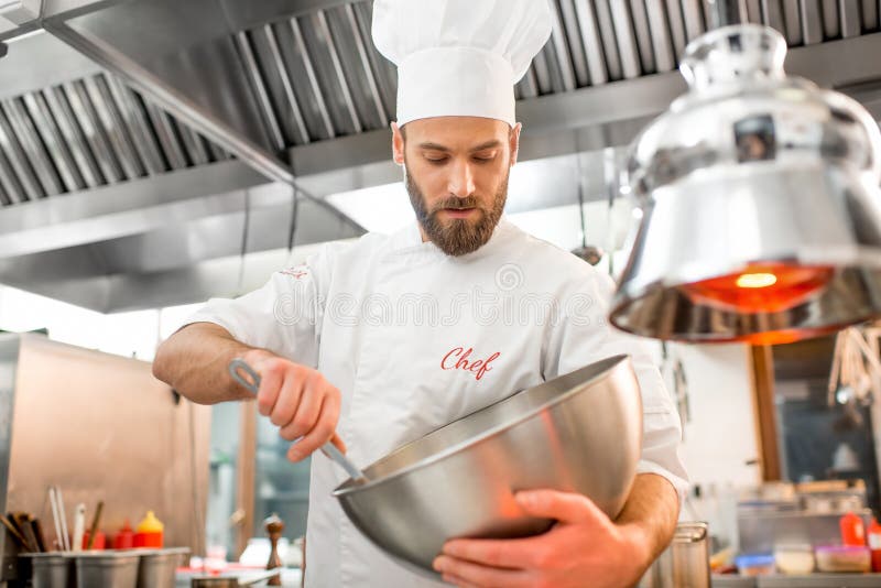 Chef cook at the kitchen stock photo. Image of indoors - 86223288