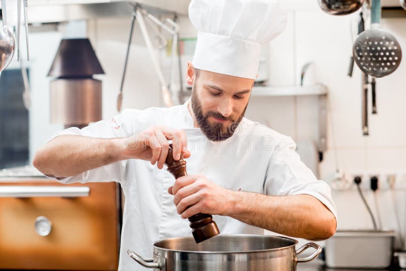 Chef cook at the kitchen stock image. Image of scoop - 86222963