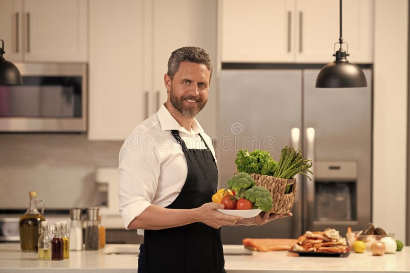 Chef Cook Man Preparing Food. Man Cook Food in Modern Kitchen. Cooking ...