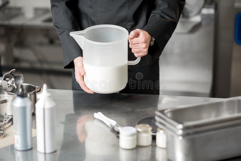 Chef cook with milk stock photo. Image of black, cook - 112771288