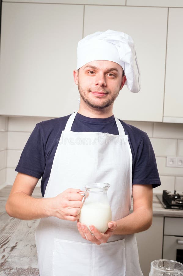 Chef Cook Pours Milk in a Glass Stock Photo - Image of black, dough ...