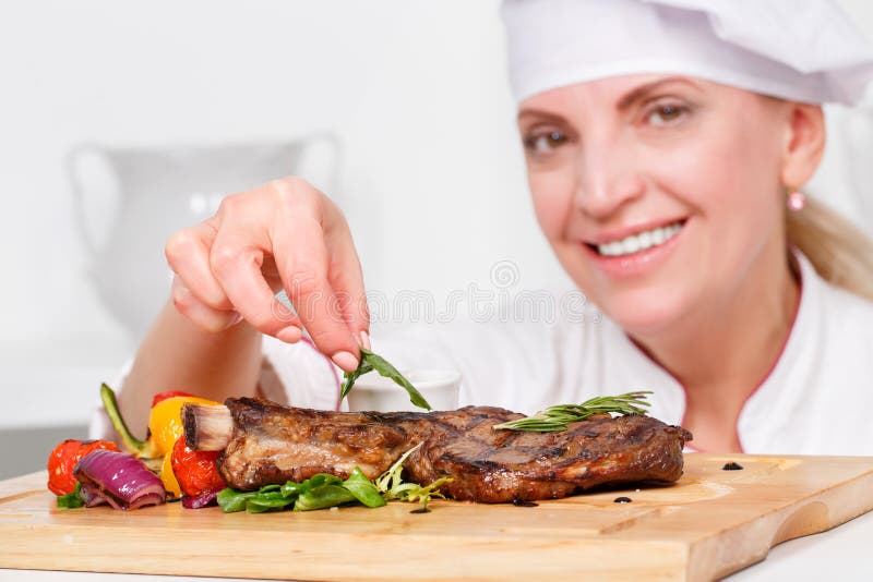 Chef-cook presenting meals stock image. Image of fresh - 52675905