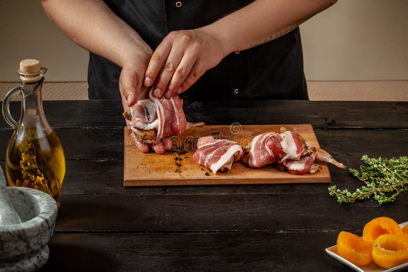 Preparing Quail Specialty, Rolling Quail with Bacon Stock Photo - Image ...