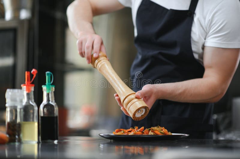 Chef Cook in Uniform Cooking in the Big Cooker at the Restaurant ...