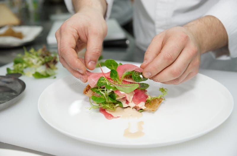 Chef is cooking appetizer stock photo. Image of fingers - 28609746