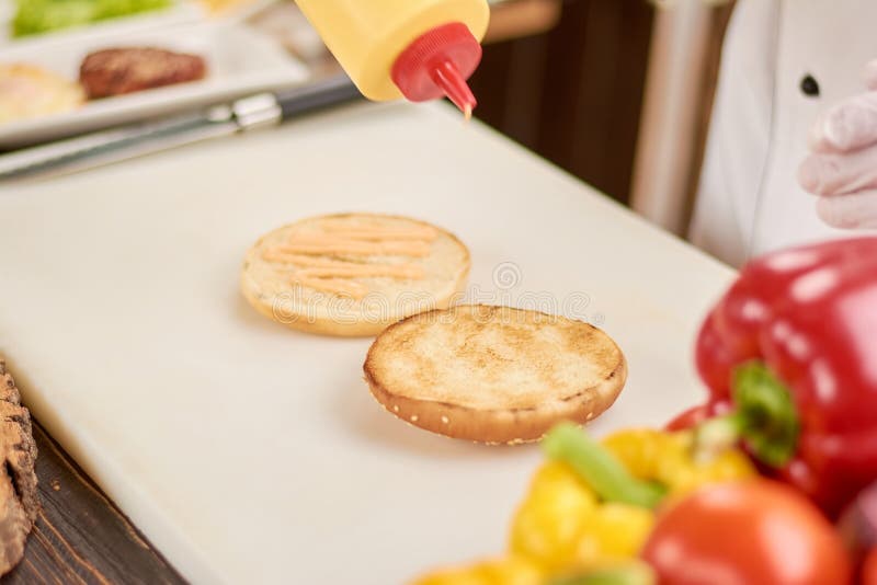Chef Cooking Burger at Kitchen. Stock Photo - Image of cuisine, burger ...