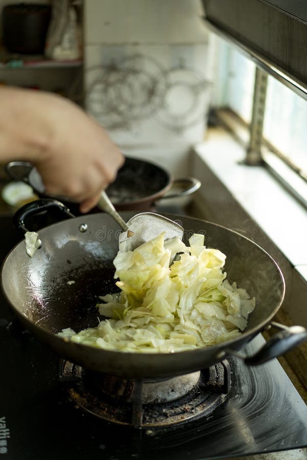 A chef is cooking cabbage stock image. Image of nutrients - 186074083