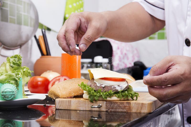 Chef Cooking and Decorated Hamburger Stock Photo - Image of frying ...