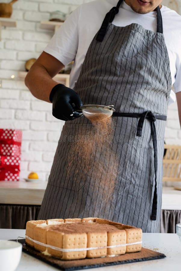 Chef Cooking Dessert in the Kitchen Pouring Cocoa Powder on it Stock ...
