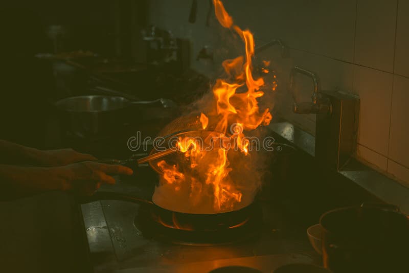 Chef Cooking and Doing Flambe on Food Stock Photo - Image of fire ...
