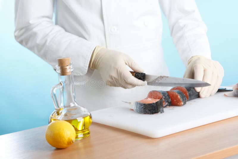 Chef cooking a fish stock image. Image of knee, salmon - 8495273