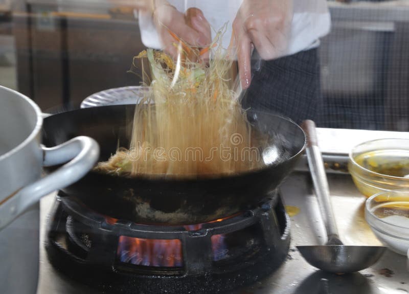 Chef while Cooking Food in the Kitchen Stock Image - Image of ...