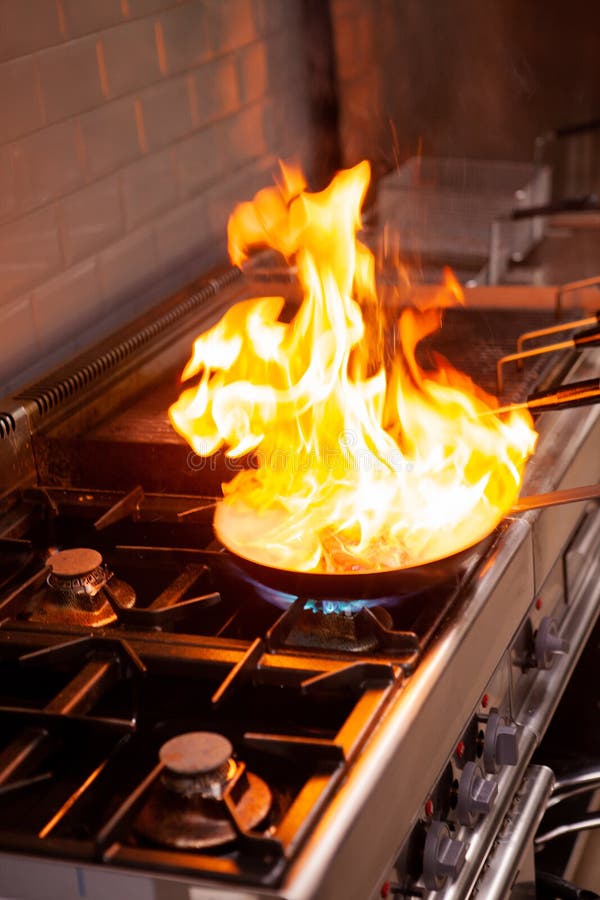Chef Cooking with High Fire in Kitchen Stock Photo - Image of ...