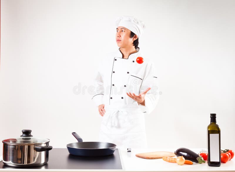 Chef Cooking in His Kitchen Stock Photo - Image of throwing, cook ...