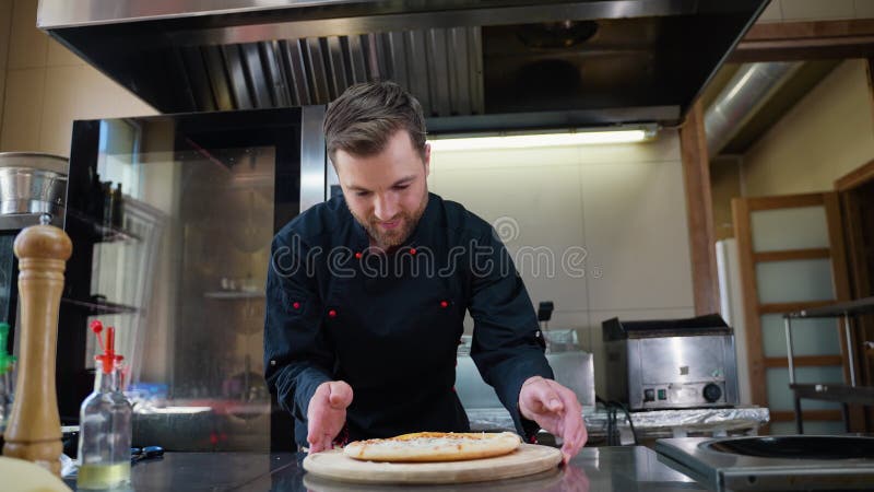 Chef Cooking Italian Pizza. the Process of Making Pizza at Table Stock ...