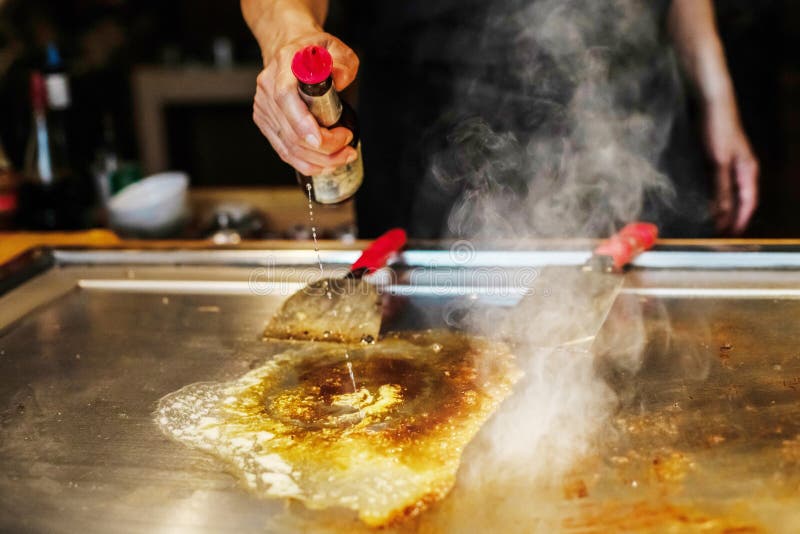 Chef Cooking in Japanese Teppanyaki Restaurant Stock Image - Image of ...